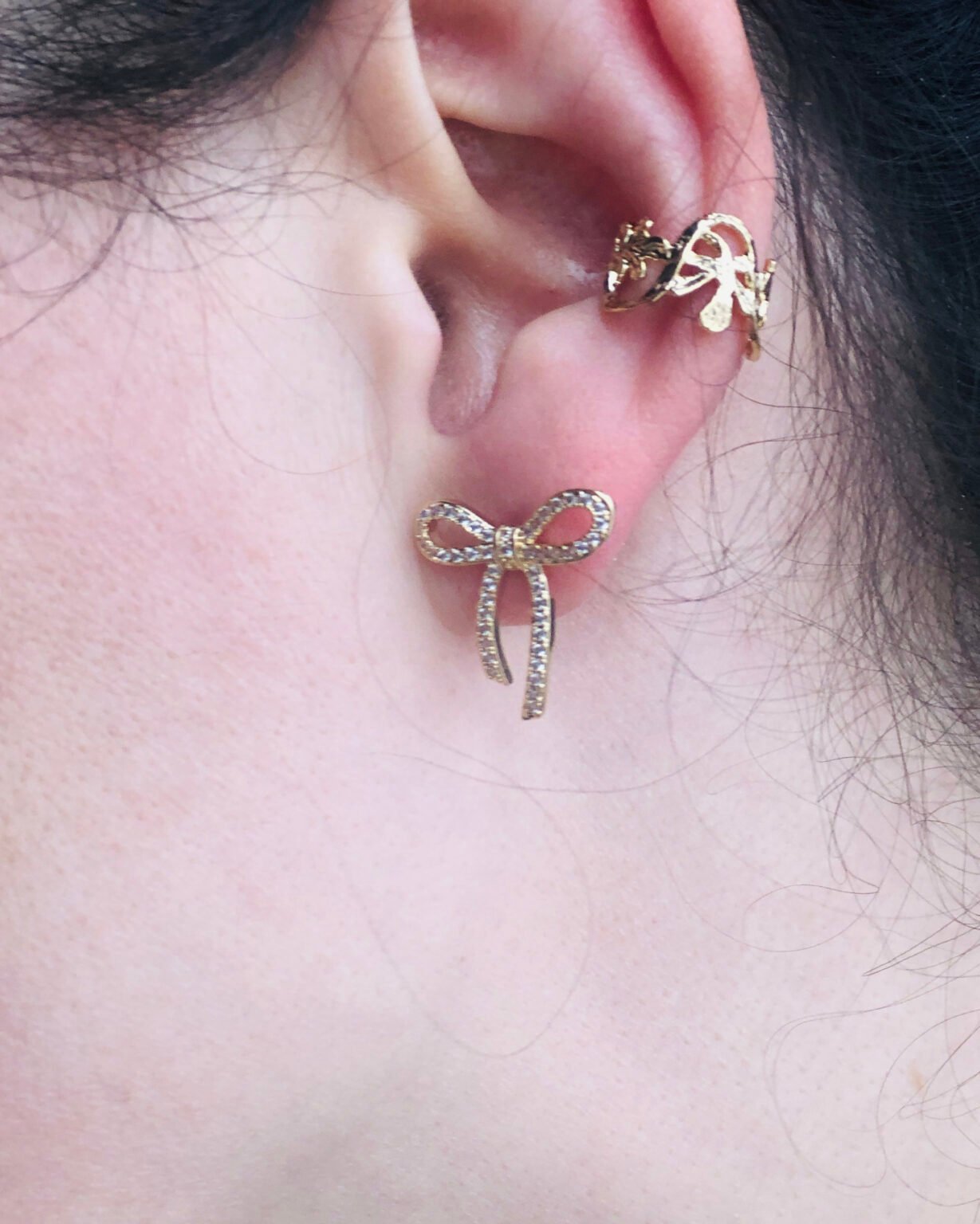 Gold fashion earrings bow shape with zirconium crystals